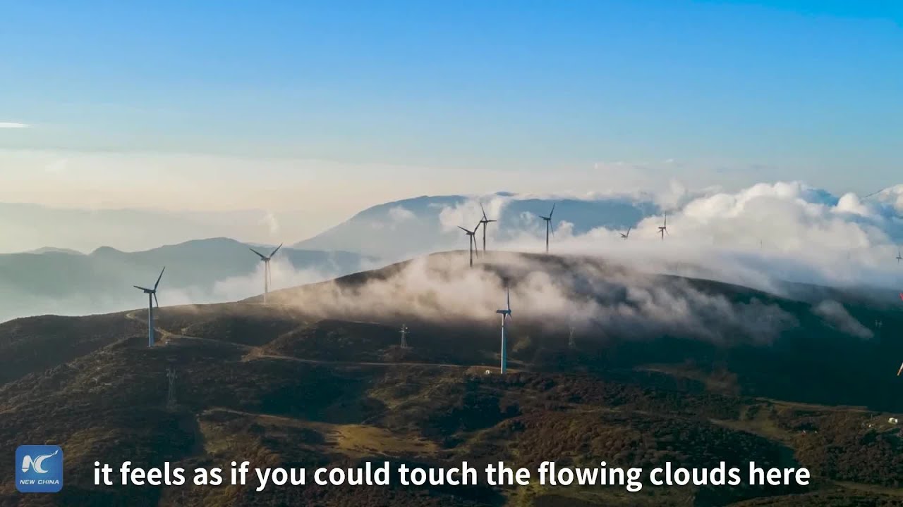 Wind farm resplendent in flowing clouds - YouTube