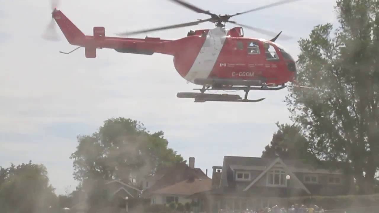 Canadian Coast Guard Helicopter takes off from beach in Victoria, BC ...