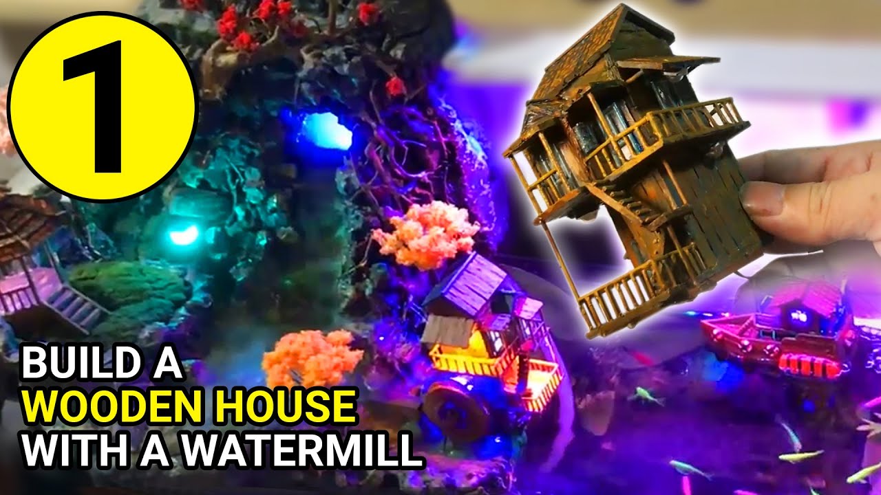 Build a wooden house with a watermill beside the stream to decorate the ...