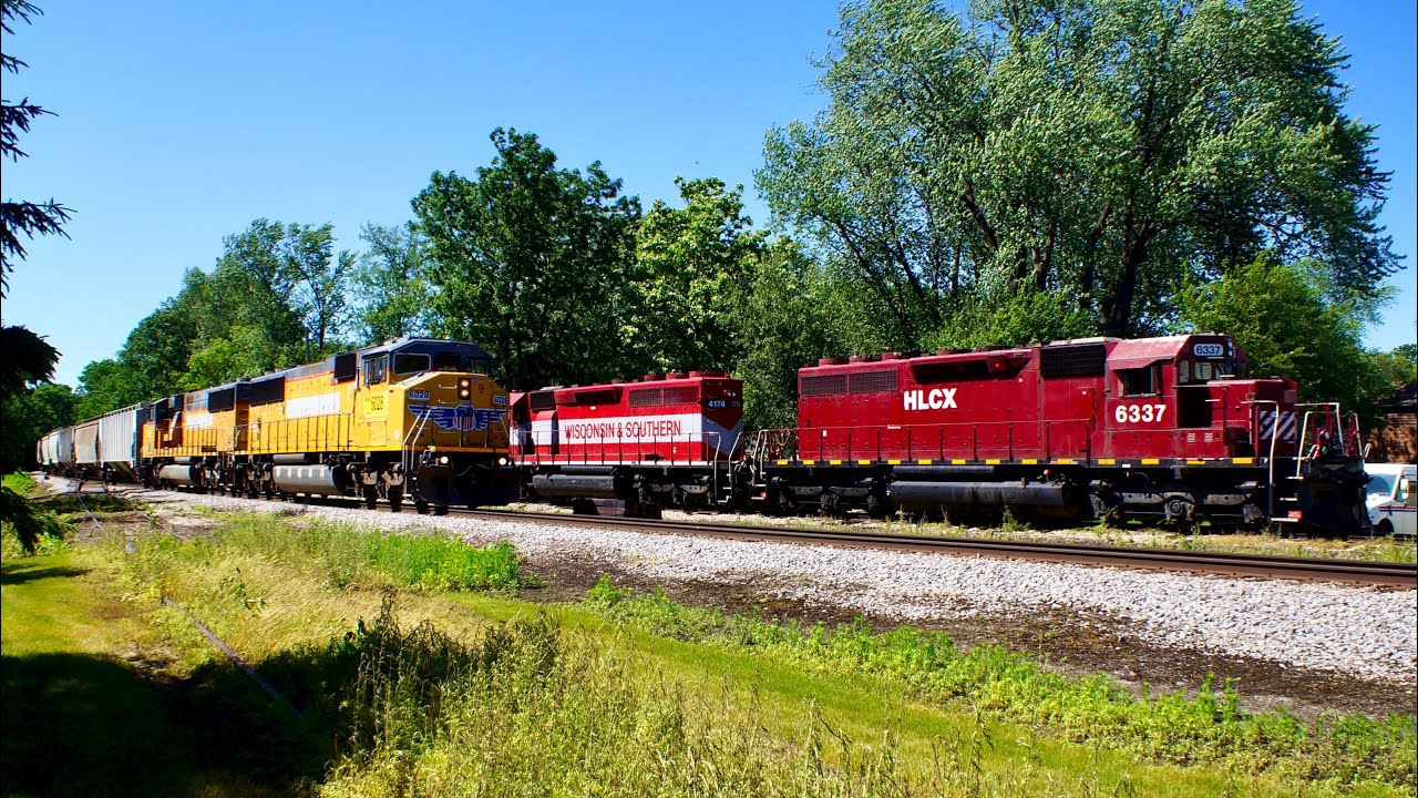Two SD60's run a rescue train after HLCX 6337 hits a backhoe at ...