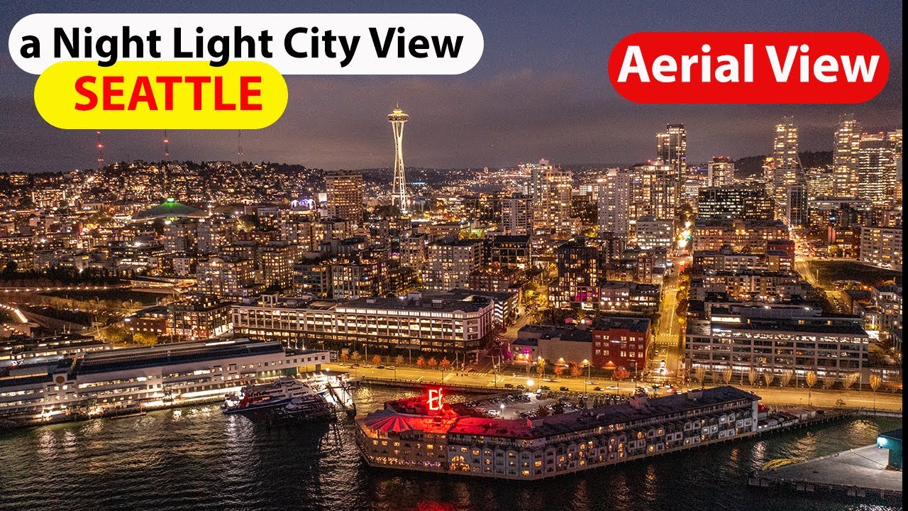 Seattle Downtown Nighttime view - flying around the waterfront area ...