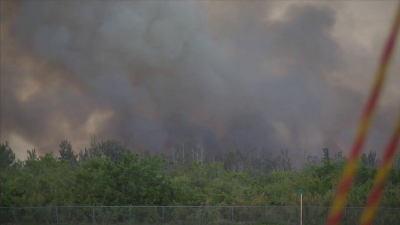 Brush fire burning since Friday continues south of Florida City - YouTube