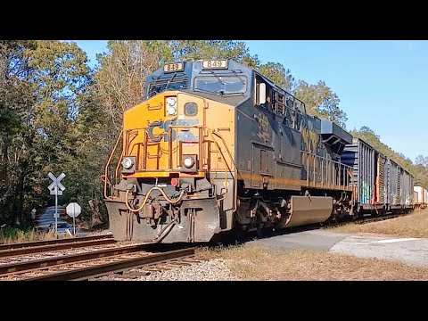 CSXT 849 leads CSX S853 military train at Shands siding Clinton SC on the CSX Monroe Subdivision ...