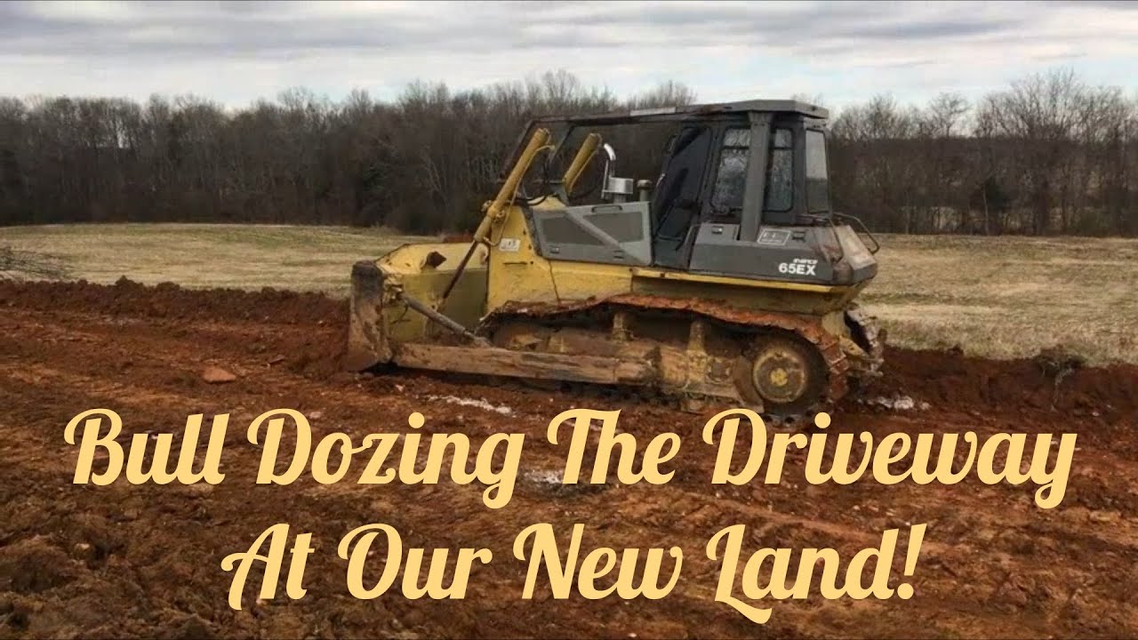 Land improvements begin! Komatsu Dozer pushes dirt and trees to make ...