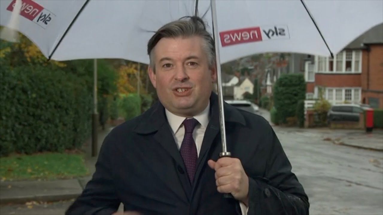 Strong wind wreaks havoc during live interview with UK politician - YouTube