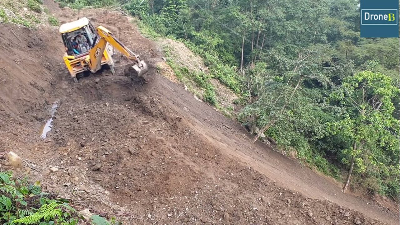Hilly Roadslide-Backhoe Loader-Removing Dirt-Fixing Damaged Hilly Road ...