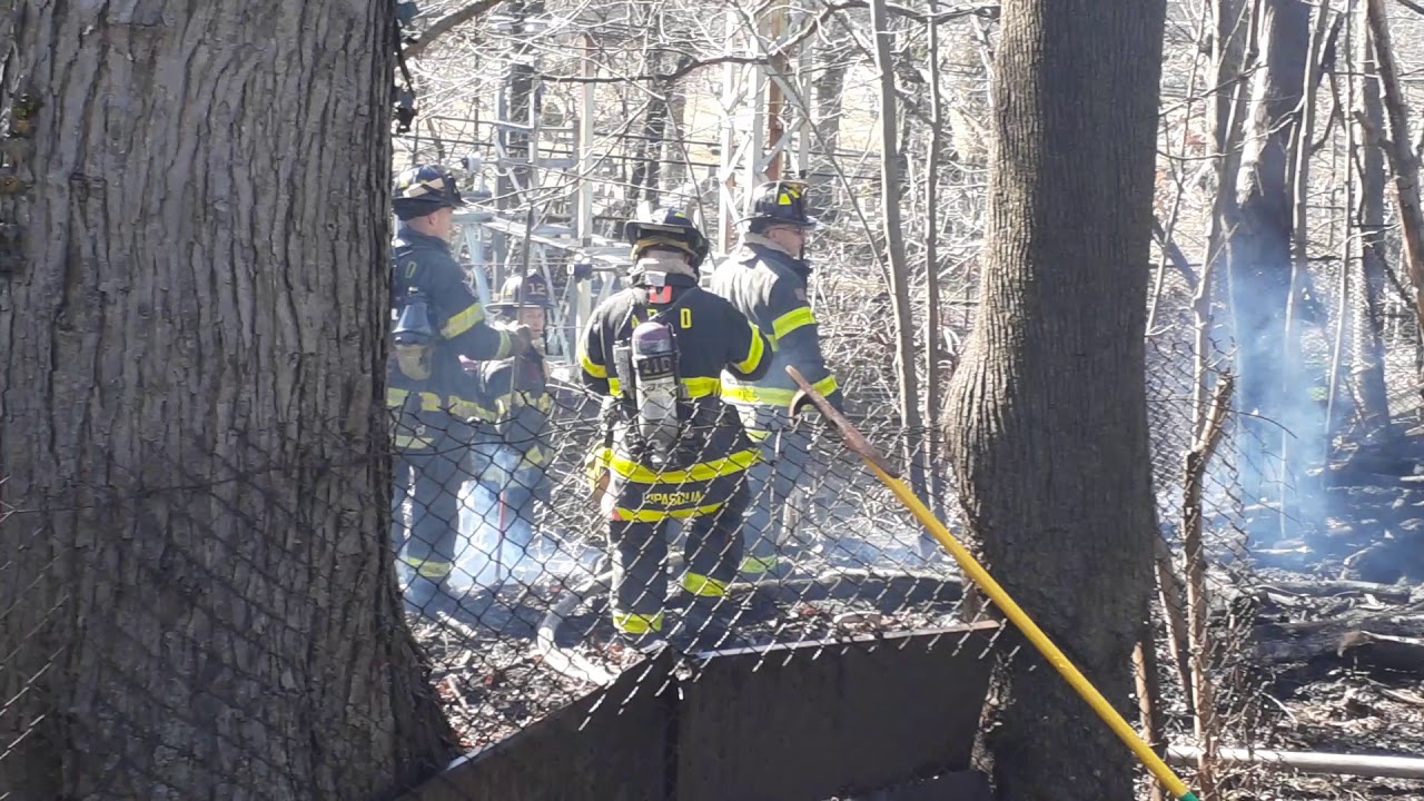 New Rochelle firefighters operating a brush fire by the train tracks 2 ...