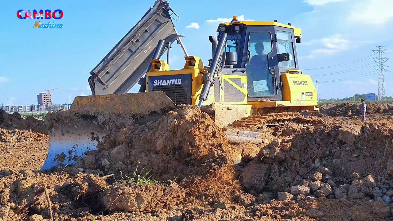 Action of Heavy Machines Dump trucks unloading dirt, Bulldozer operator ...