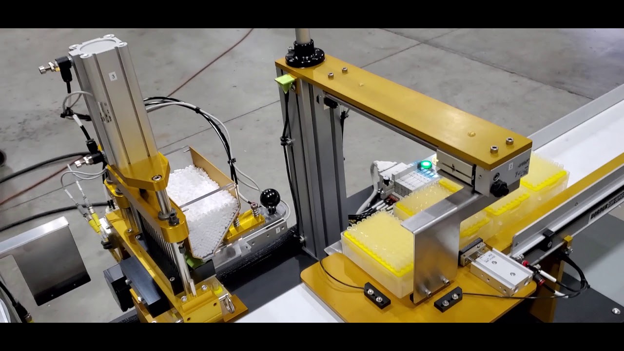 Inserting 200 size filters Into 96 well racked tips - YouTube