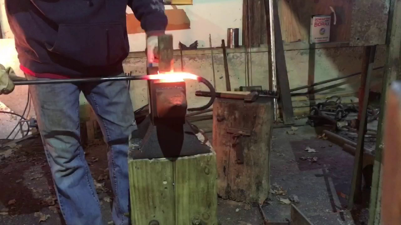Forging a handle for a branding iron - YouTube