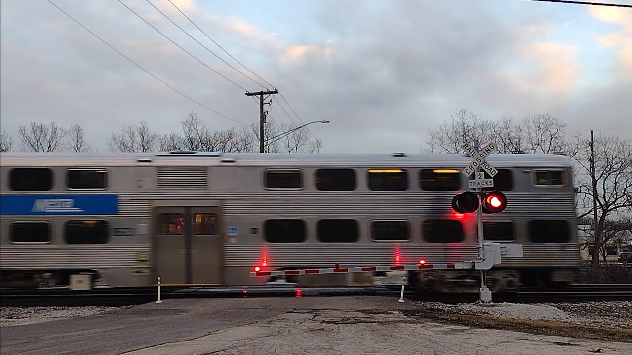 Metra cab-car 8523 east with MP36 420 at Elgin, Illinois on February 28 ...