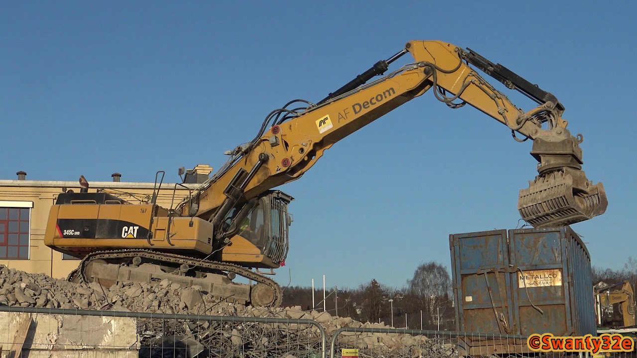 4K| CAT 345C UHD Excavator Working At A Demolition Site And Volvo FH ...