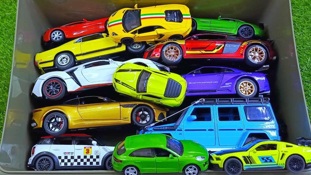 Box full of various miniature cars Jaguar, Peugeot, Renault, Hyundai ...