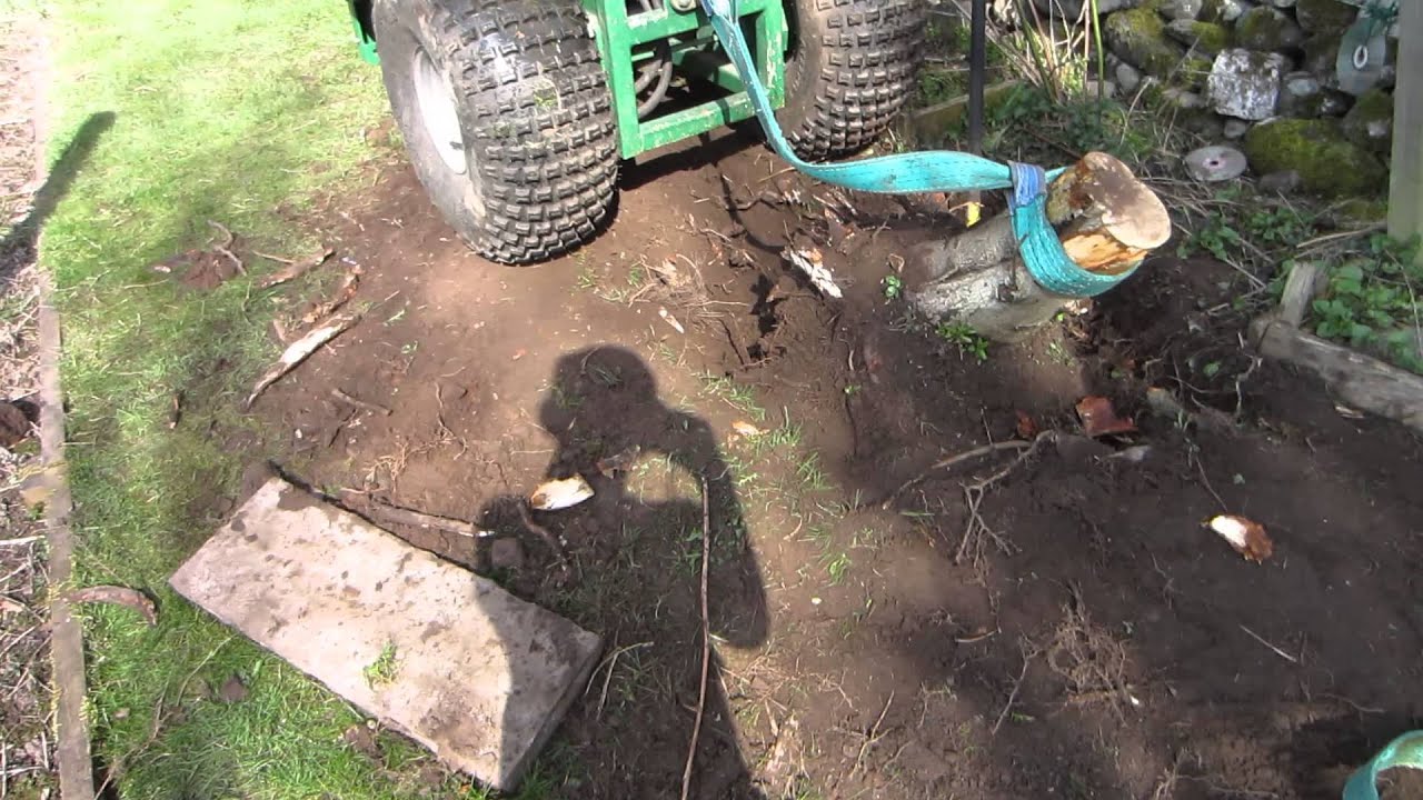 Pulling tree stump with hydrostatic barrow - YouTube