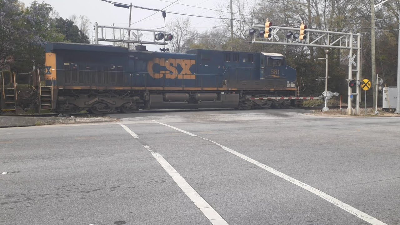 CSXT 581 leads CSX M692 out of Greenwood SC with 4 SD70MAC dead in dow - YouTube