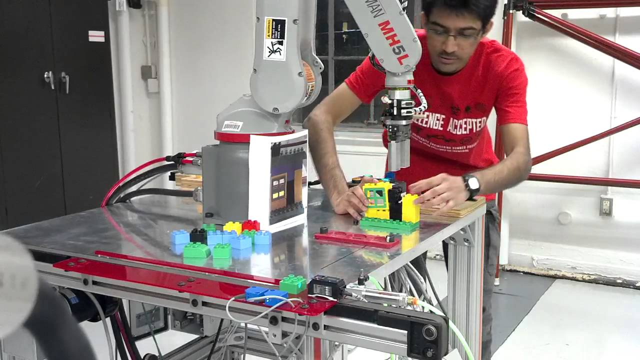 Industrial Robot builds house of Lego blocks - YouTube