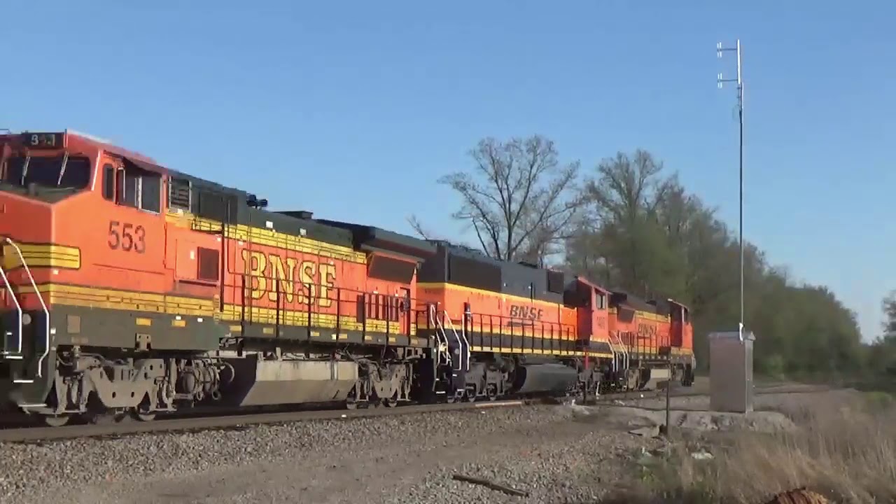 3 BNSF units lead the BNSF LCHI6571 all in different livery schemes ...
