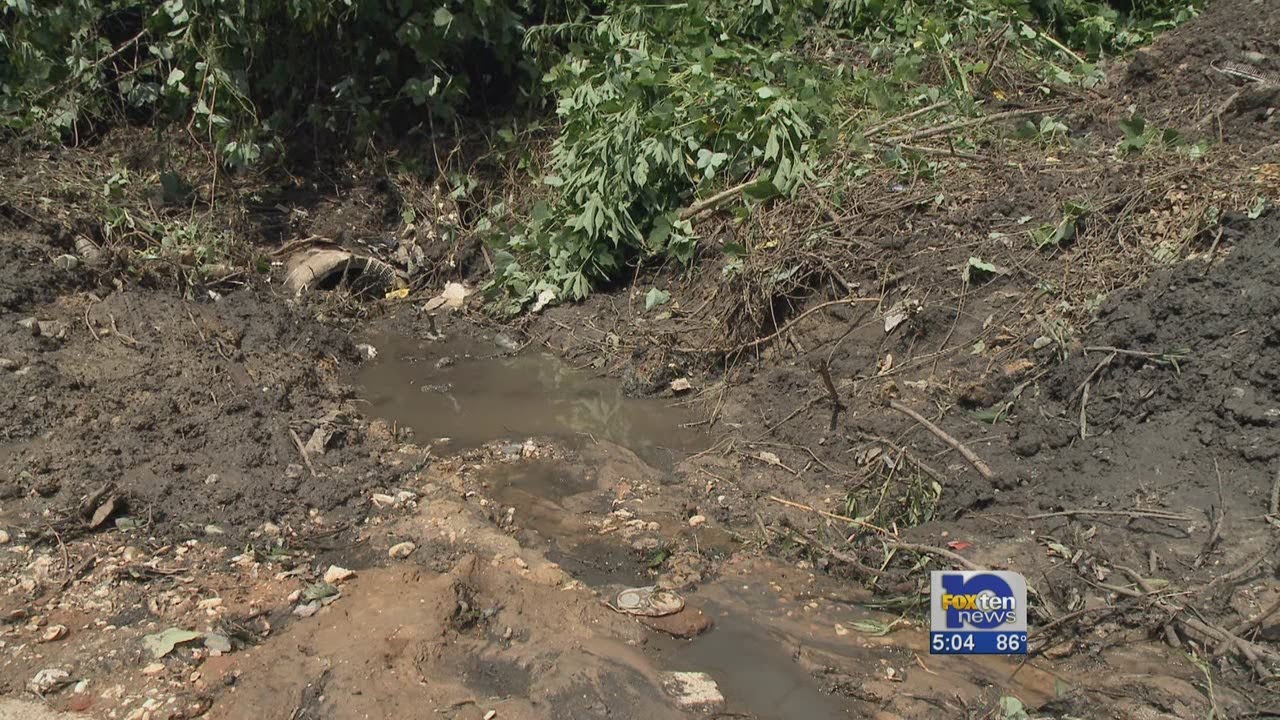Public Works works on standing water problem - YouTube