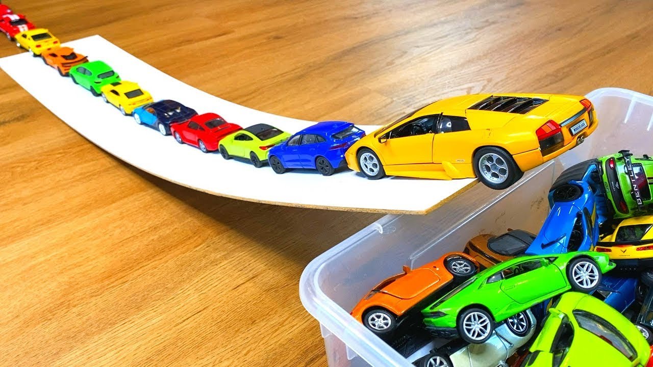 Various Diecast Model Cars Moving Down On Slider. Slope driving test ...