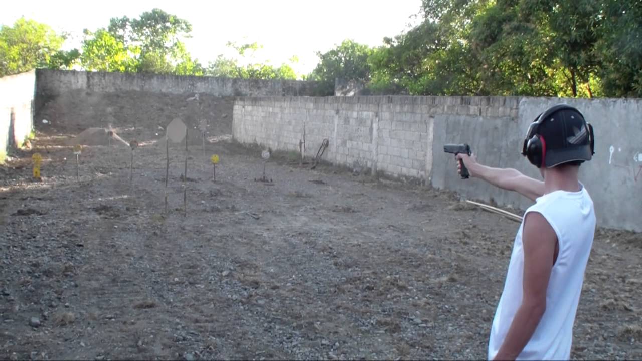 Shooting a 45 caliber in the Philippines. - YouTube