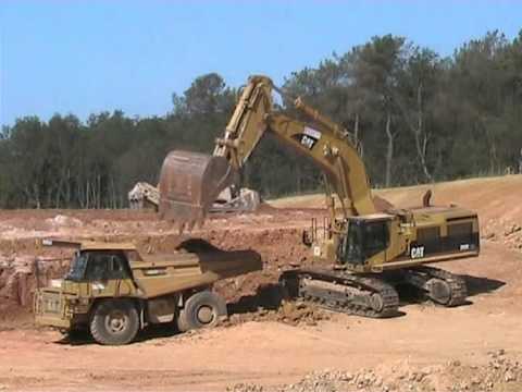 CAT 385B LME with massive bucket loading 769D's - YouTube