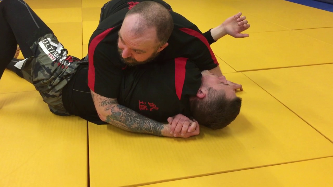 Reverse head and arm strangle and cradle pin - YouTube