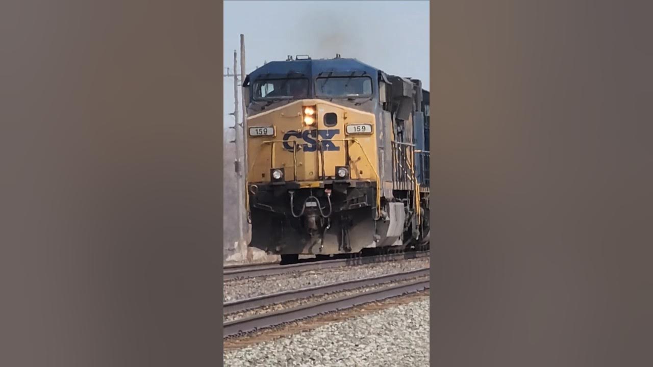 Two CSX trains meet with old AC4400s leading. One has a little wobble! #shorts #ac #wind # ...