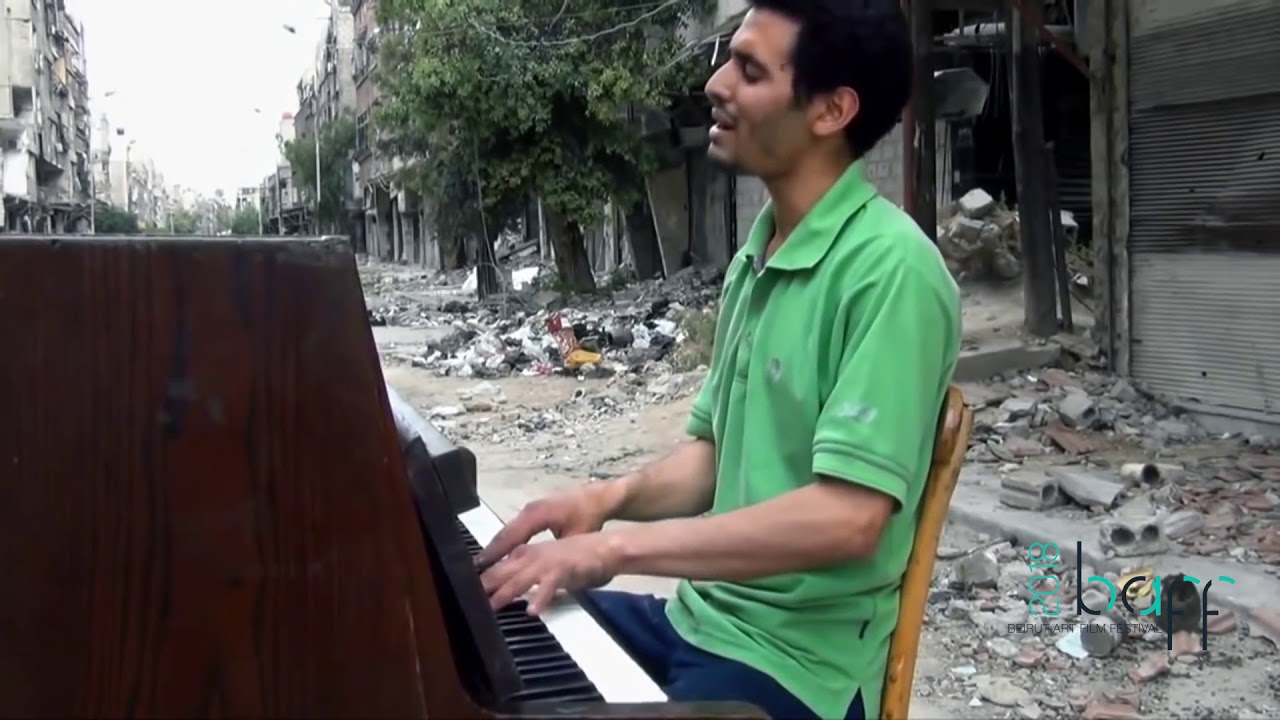 Ayham Ahmad, the Pianist of Yarmouk - YouTube