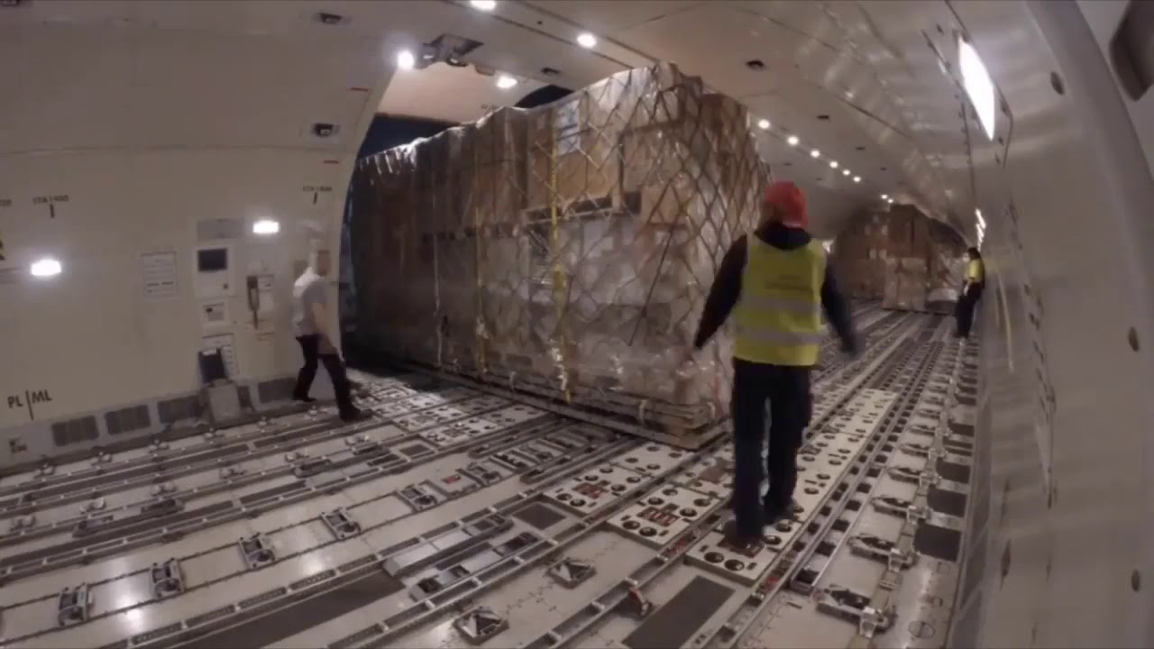 Cargo loading into aircraft - YouTube