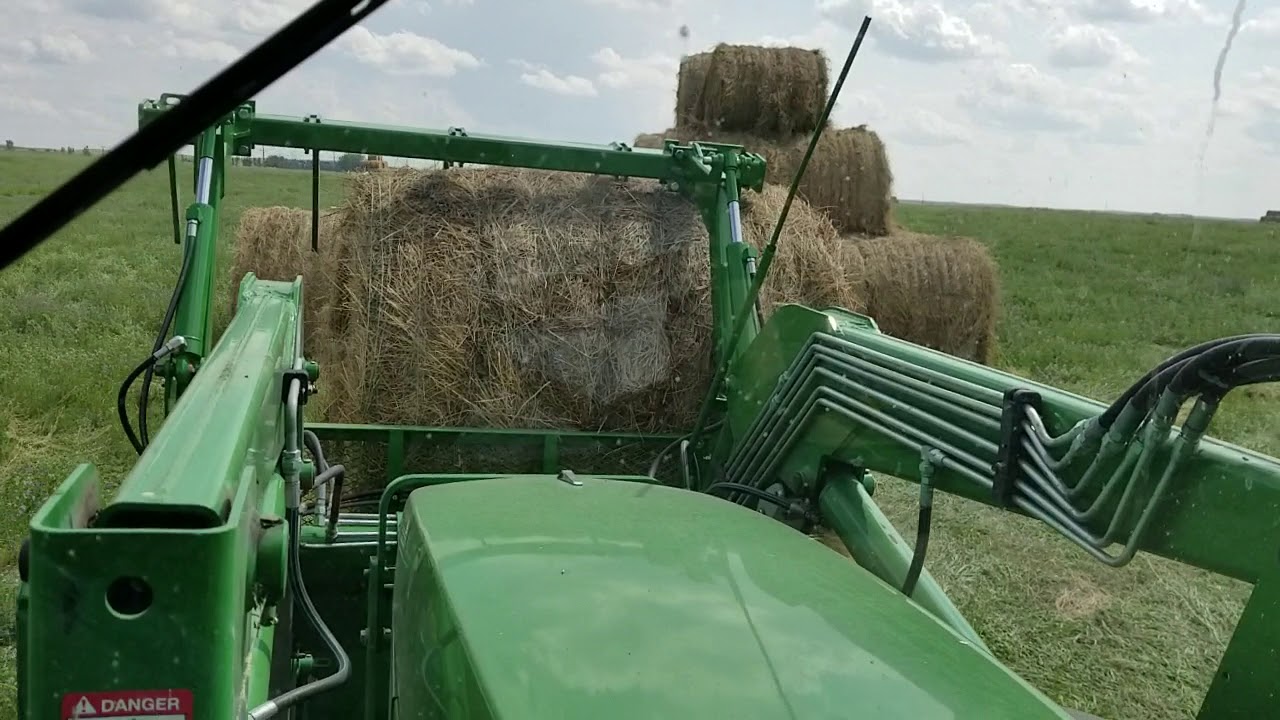 Stacking bales - YouTube