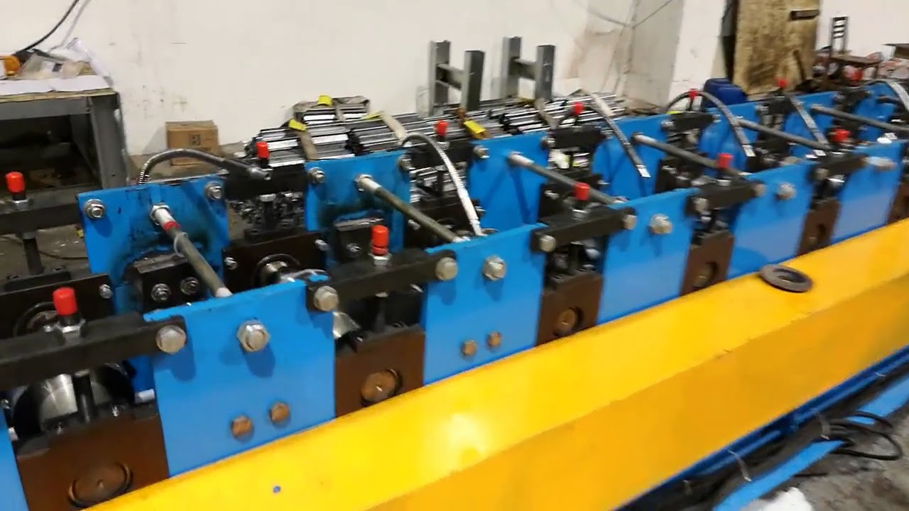 Steel Omega roll forming machine with hydraulic punching - YouTube