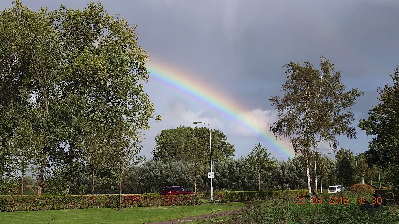 Rainbow and real Dutch Clouds - YouTube
