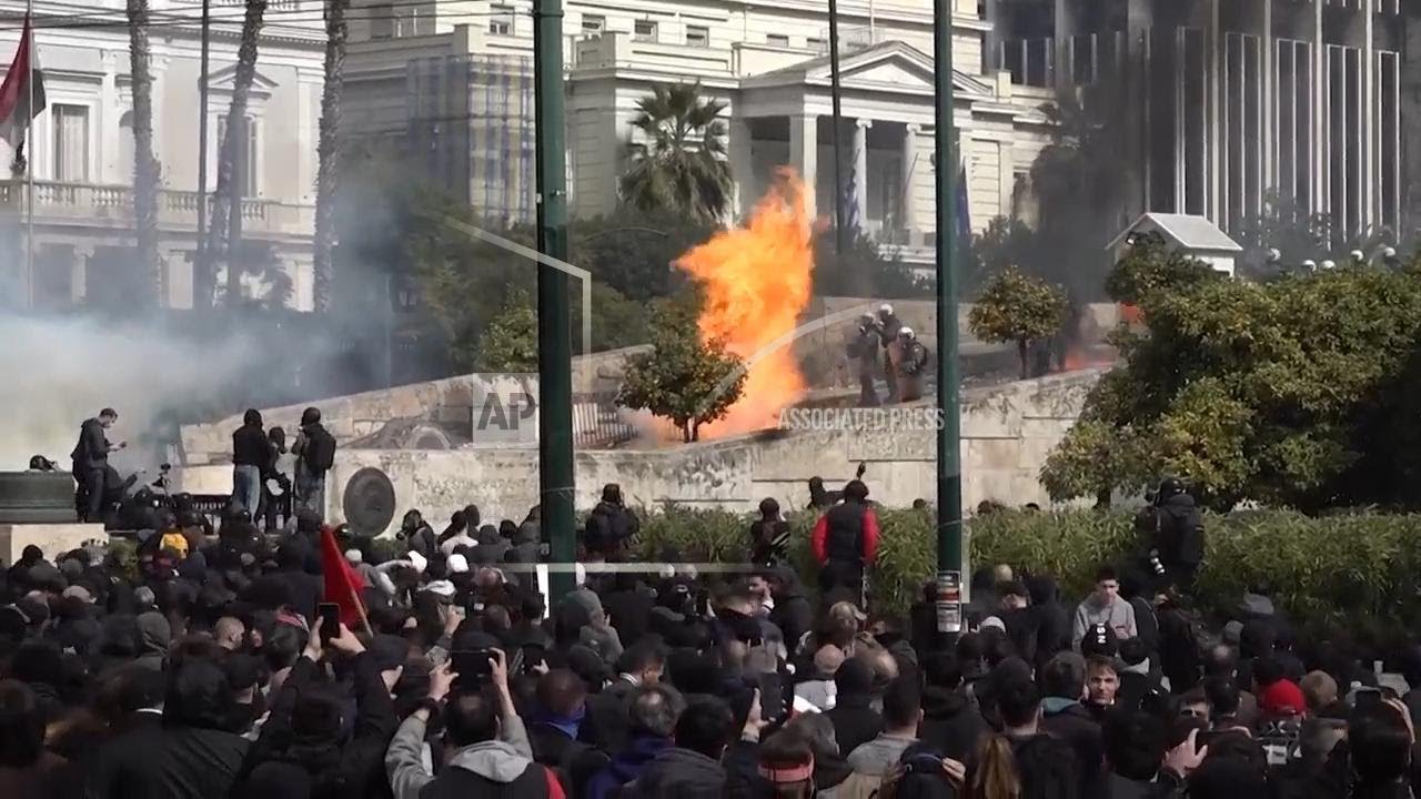 Protesters and police clash in Athens on deadly train crash anniversary ...