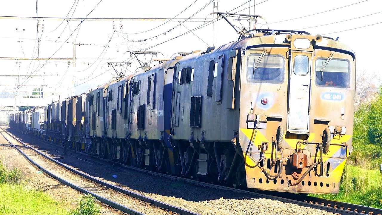 Locomotives moving various TRANSNET freight trains on a beautiful sunny ...