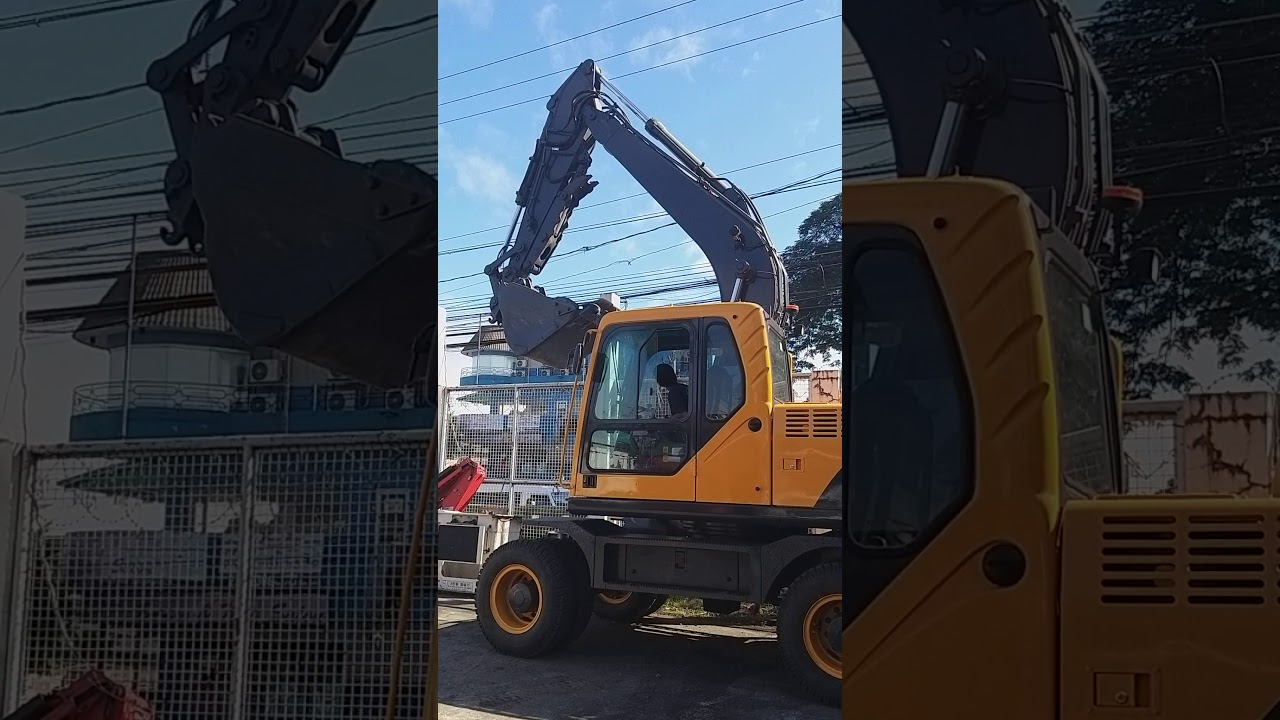 VOLVO EW145B wheel type excavator - YouTube
