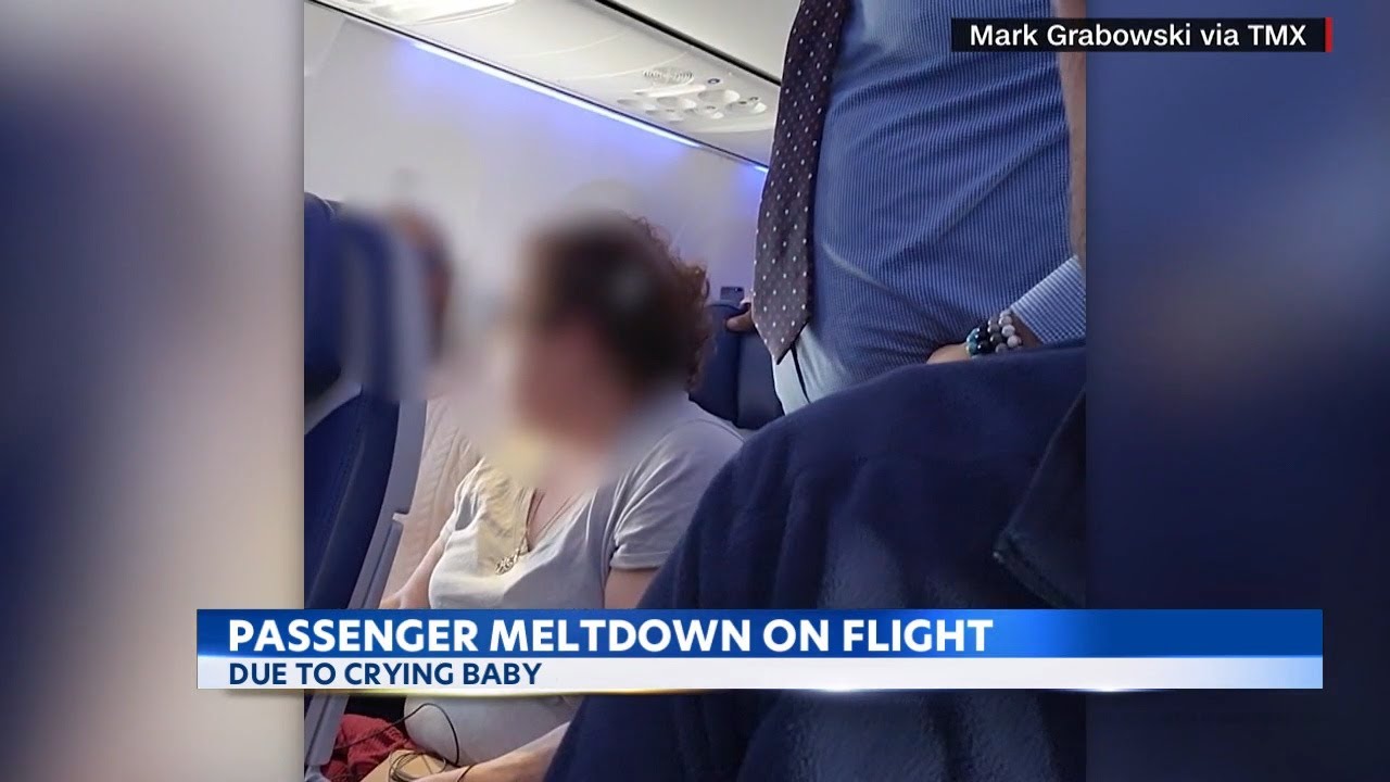 Passenger has meltdown over crying baby on plane - YouTube