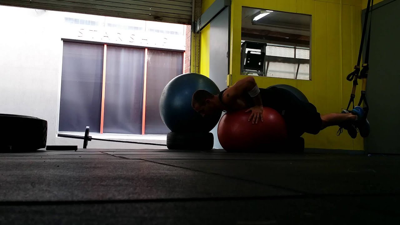 TRX + Fit ball suspended Push ups with bent leg crunches. - YouTube