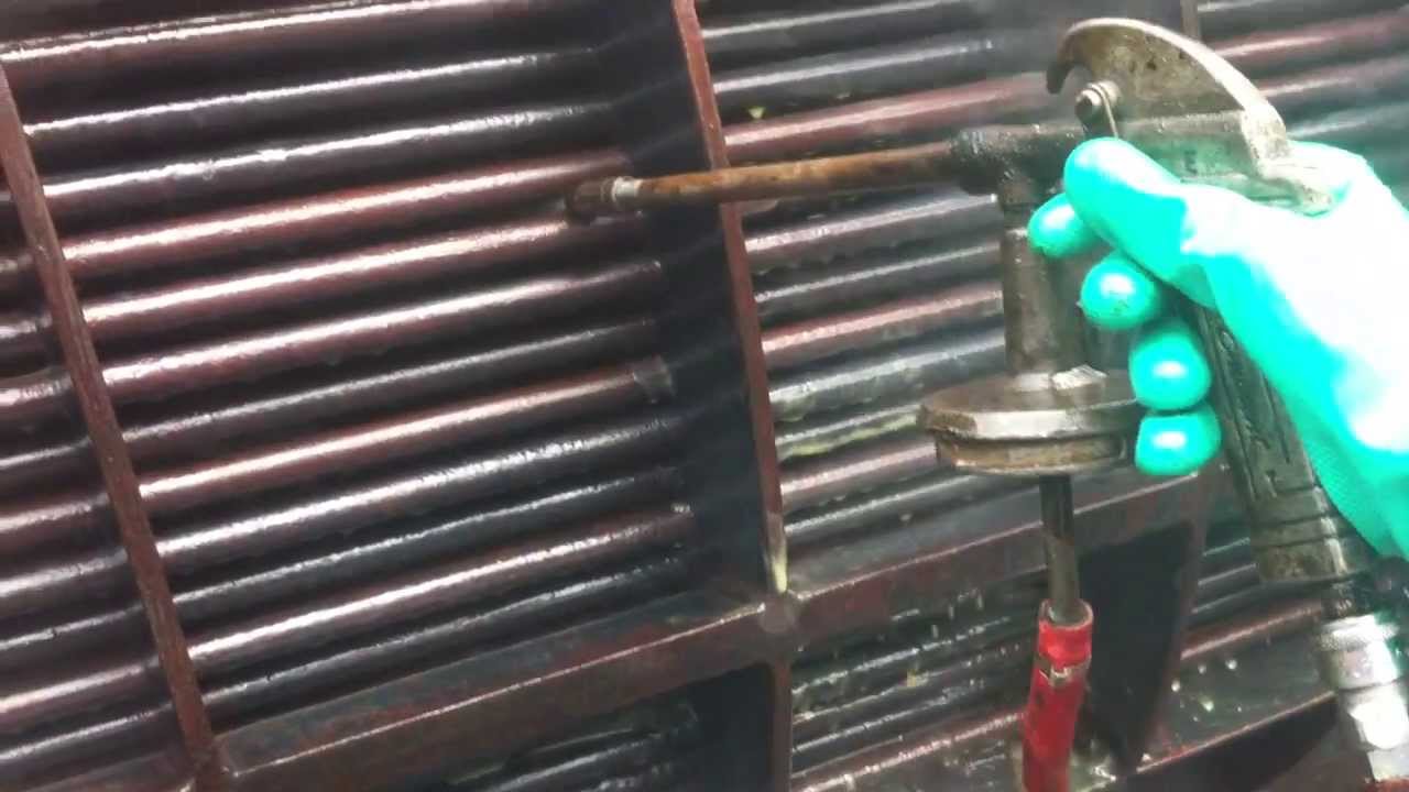 Spraying Mobilarma 798 in between tube rows of EKE16 - YouTube