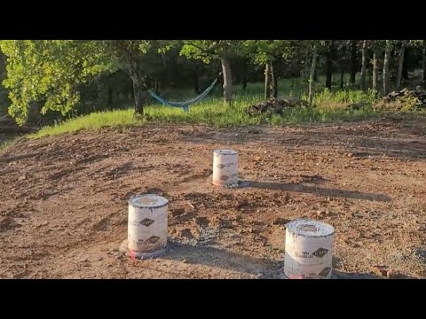 Setting Pier foundation shipping container home - YouTube