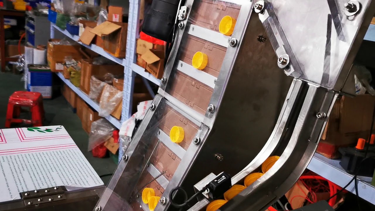 Automatic cap wad inserting machine - YouTube