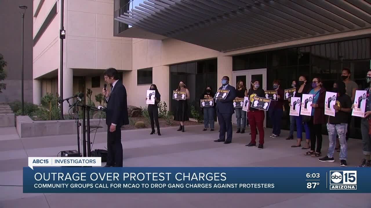 Outrage over gang charges for police protesters in Phoenix - YouTube