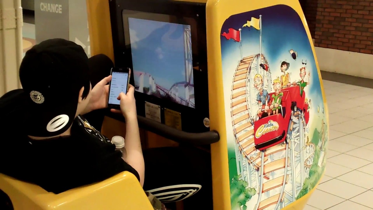 Angela rides the kiddie coaster - YouTube