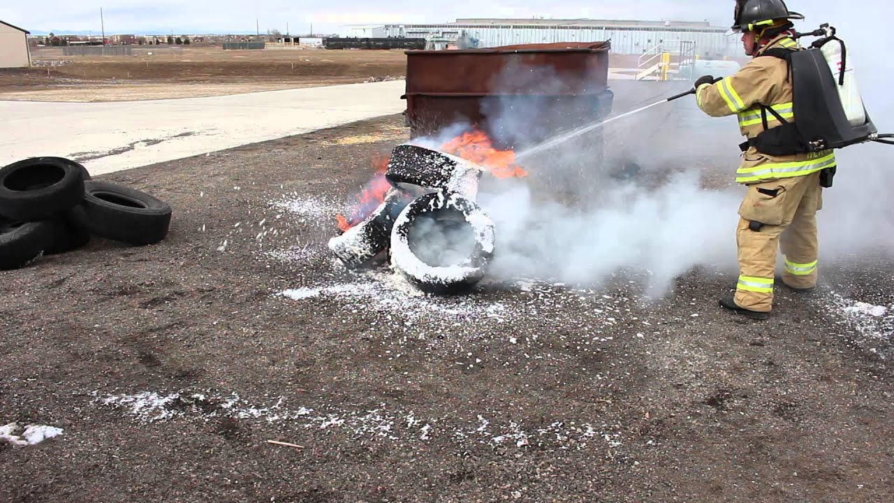 Intelagard Macaw backpack putting out a tire fire - YouTube