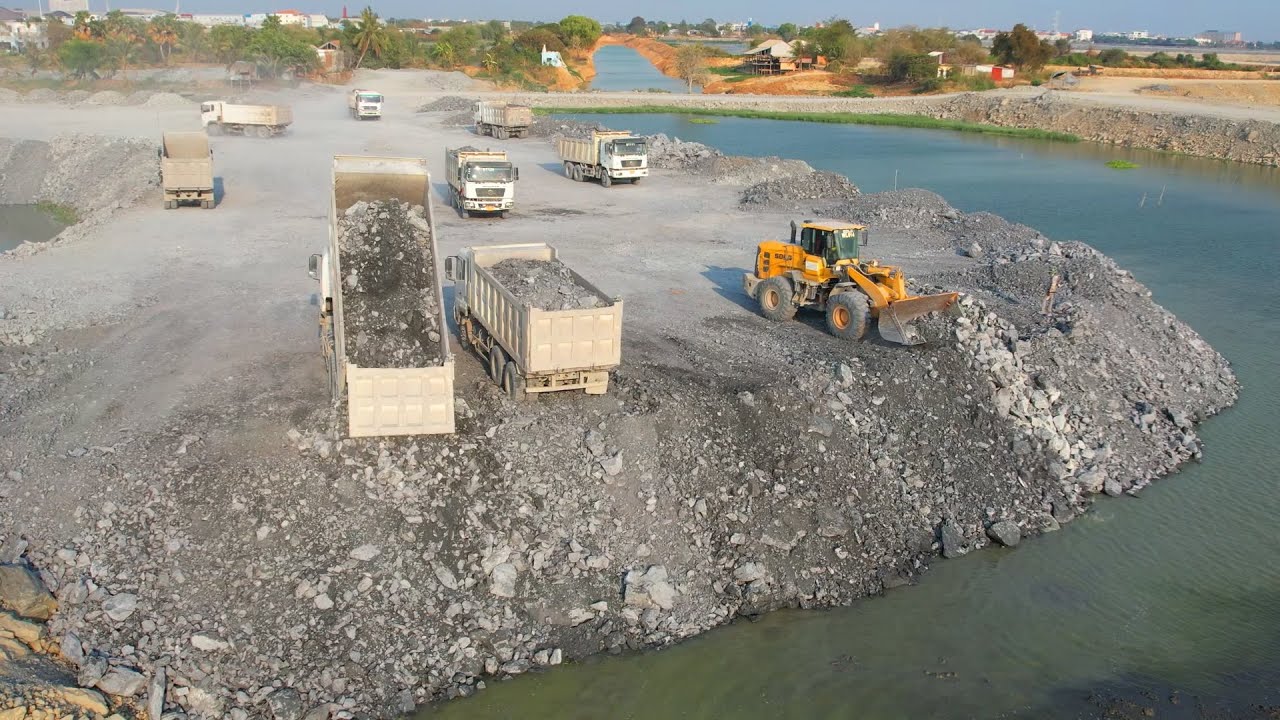 Wonderful Project With Heavy Wheel Loader Pushing Stone And Dump Trucks ...