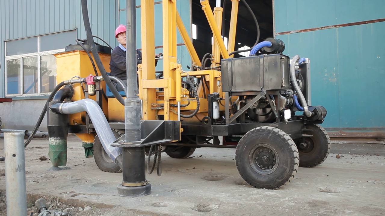 Pile driver for drilling in rock with vacuum cleaner - YouTube