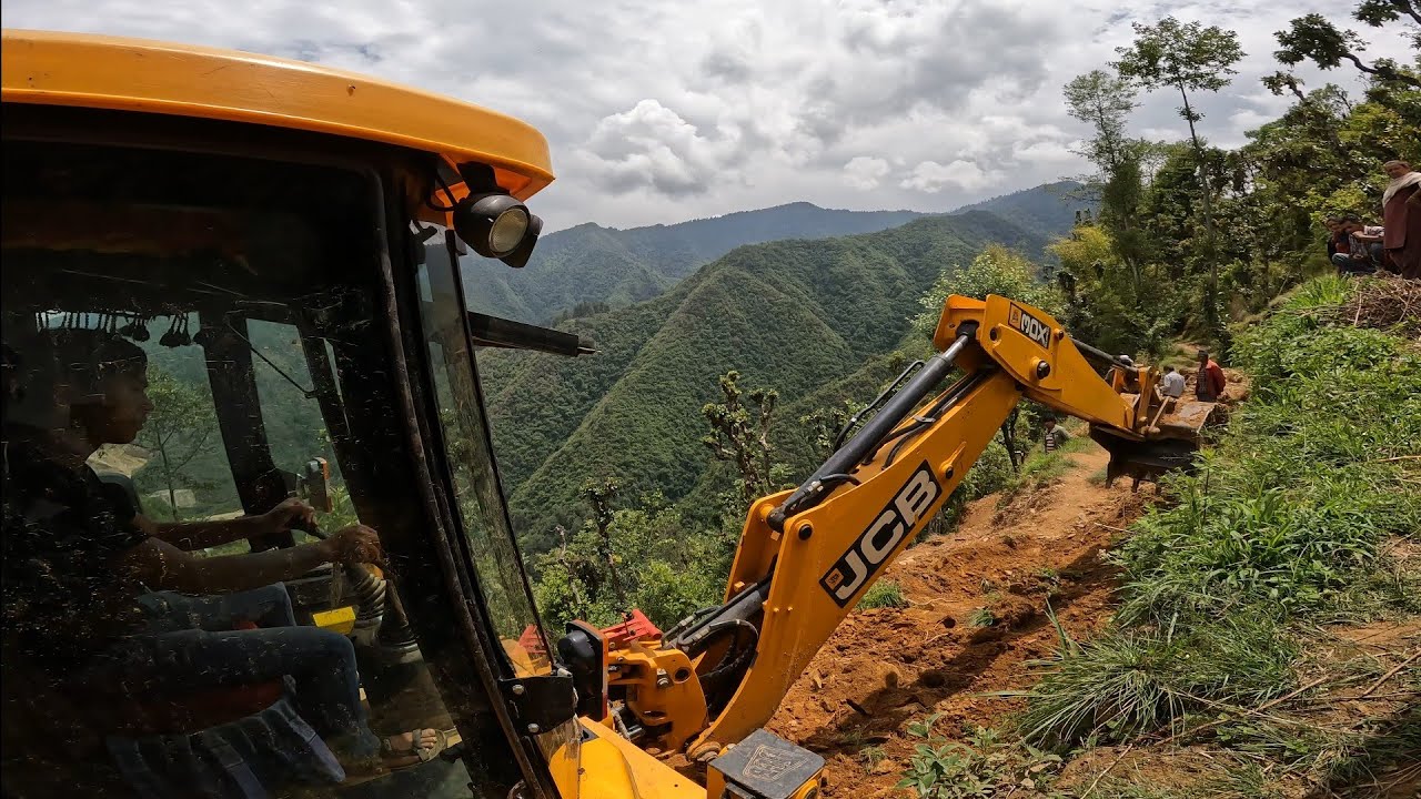 Jcb on mountain village narrow road construction - YouTube