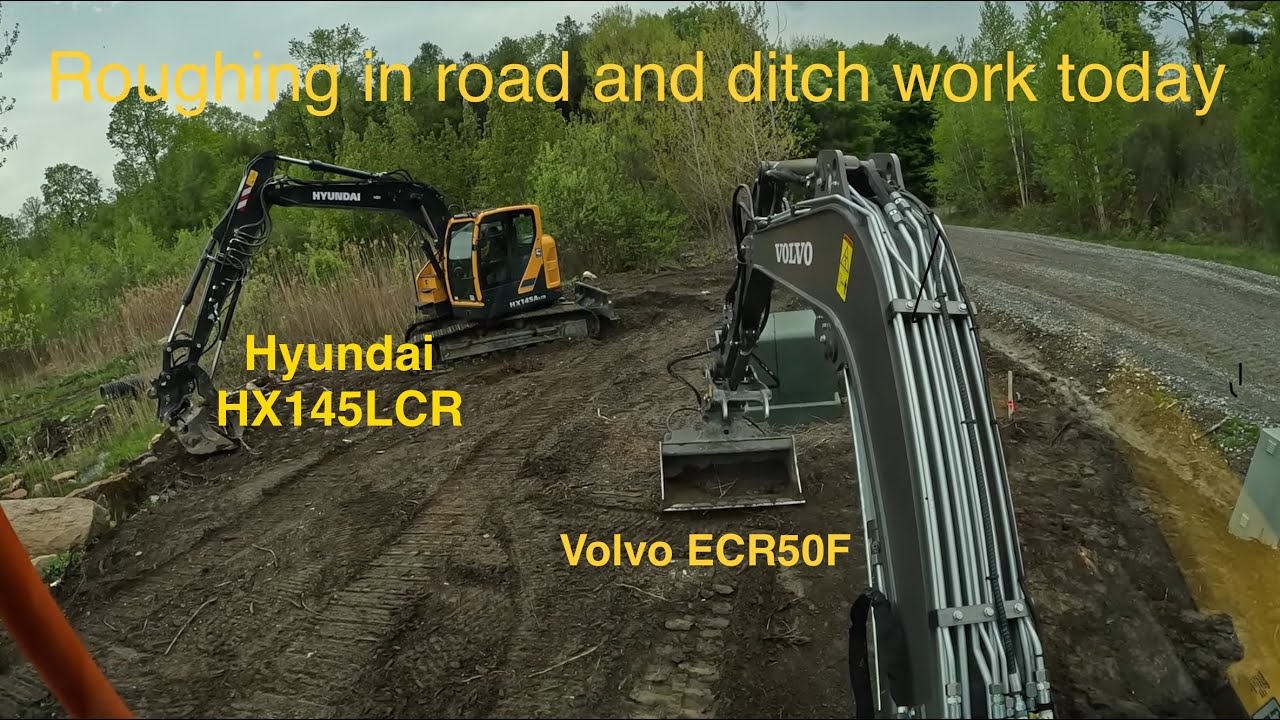Roughing in a new road and some ditch work - YouTube