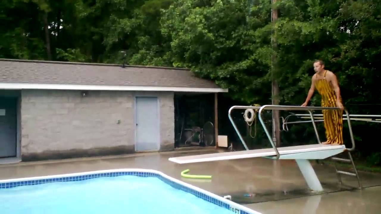 Packers fan jumps in pool with overalls on. - YouTube