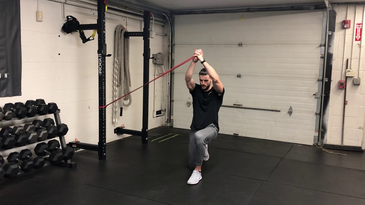 Half-Kneeling Banded OH Pallof Press - YouTube