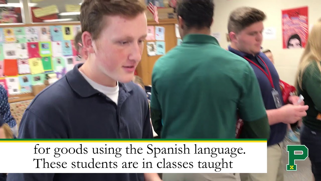 Bartering your way through a classroom bazar using Spanish - YouTube